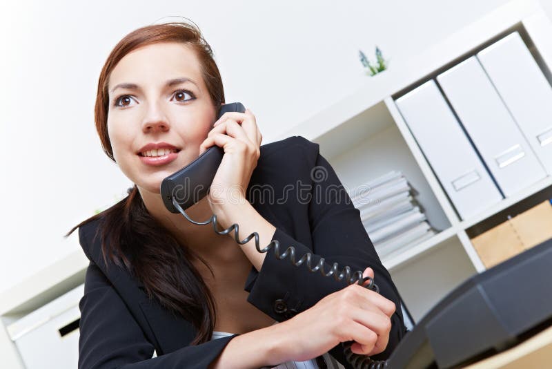 Secretary Using Phone in Office Stock Image - Image of customer ...