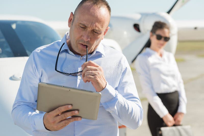 Secretary Waiting for Boss To Board Aircraft Stock Photo - Image of ...