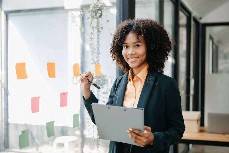 Secretary Working in Modern Office in Skyscraper, Writing and Sticking ...