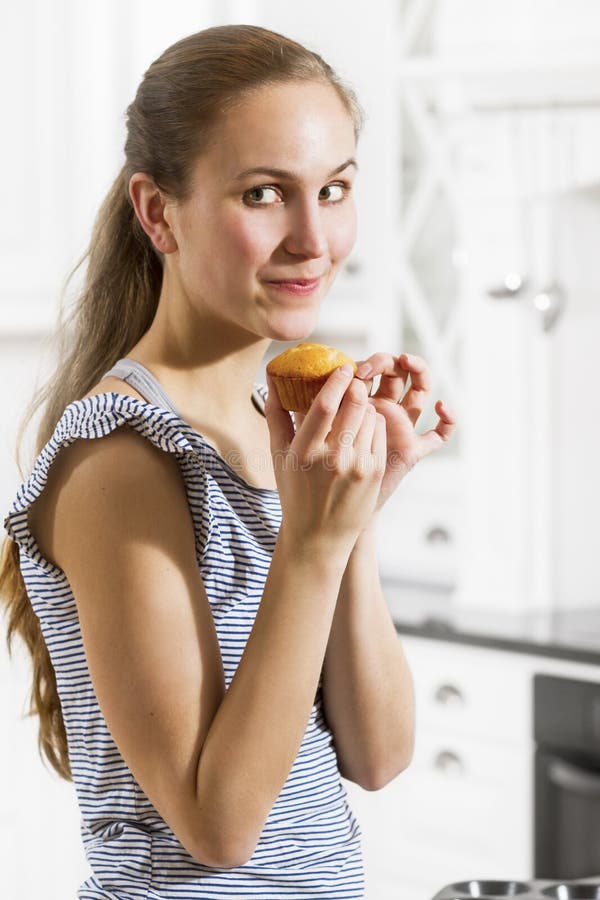 Secretive Girl Eat Muffins stock photo. Image of white - 29645236