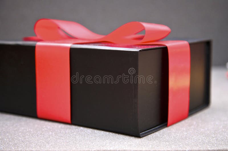 Black box and red ribbon stock photo. Image of gift - 197054912