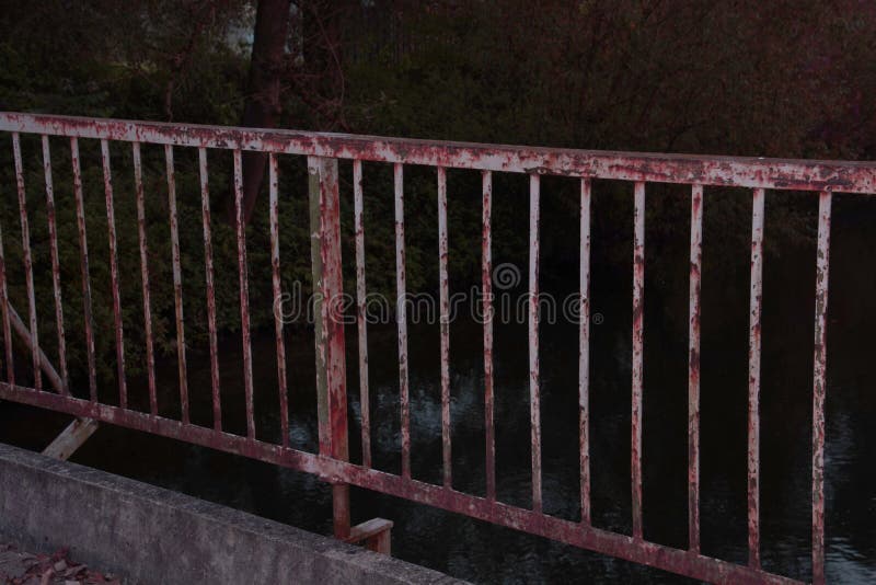 Section of a Bridge Railing in the Dark with Rust and Peeling Paint ...