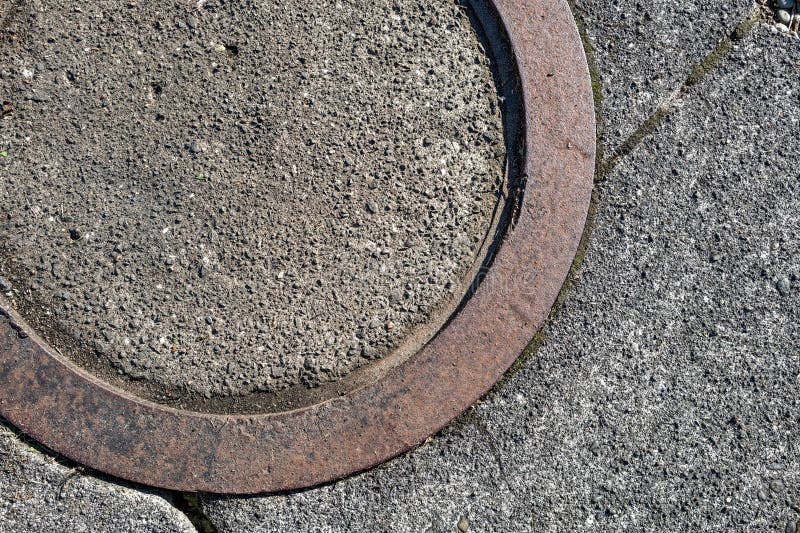 A Section of the Circular Metal Rim of a Drainpipe Cover in the ...