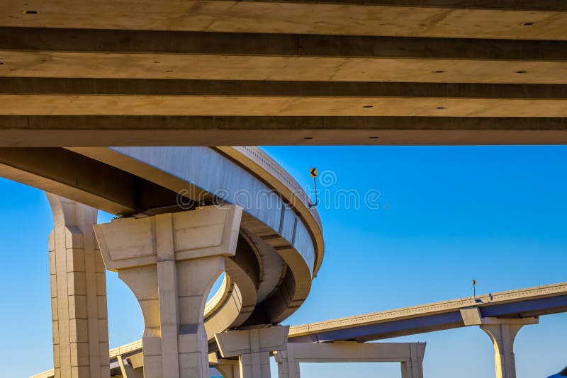 Section of Elevated Highway with Several Levels Against a Bright Blue ...