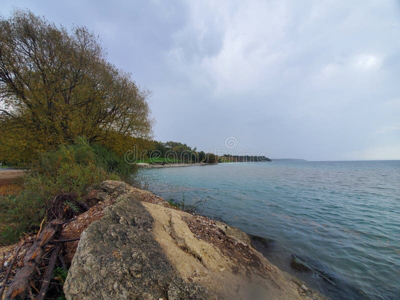 A Rocky Shoreline in Goderich, Ontario Stock Photo - Image of colours ...