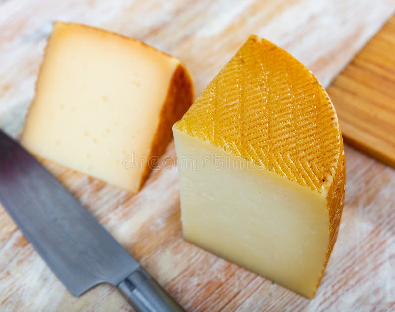 Sector of Spanish Cheese on Wood Surface Stock Image - Image of ...