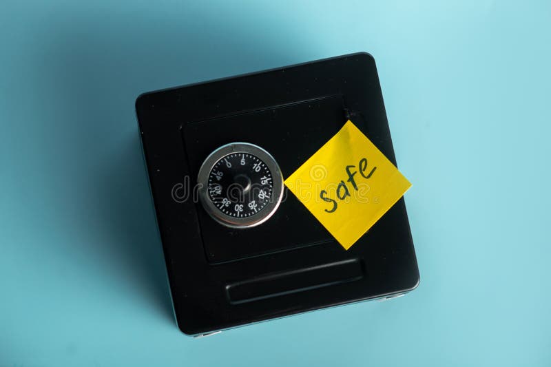 Secure Black Safe with Combination Lock and Sticky Note on Blue ...