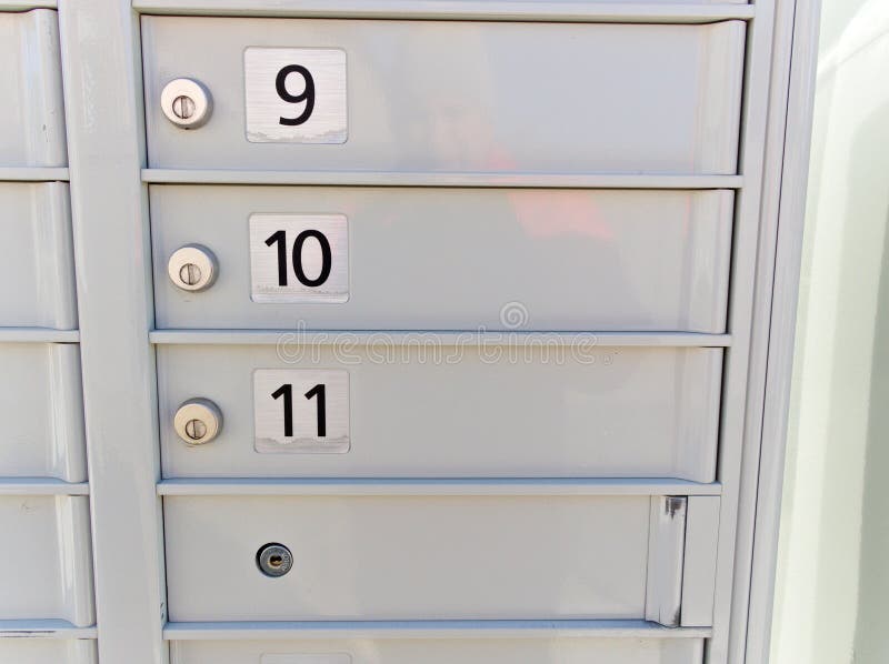 Secure community mailboxes stock photo. Image of hand - 371993322