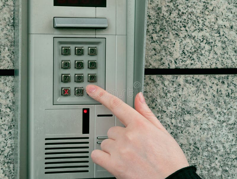 Hands Pressing on Intercom stock image. Image of access - 247689757