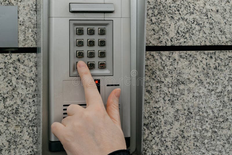 Hands Pressing on Intercom stock image. Image of modern - 247689761