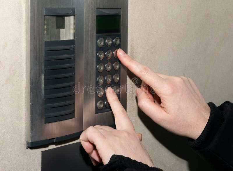 Hands Pressing on Intercom stock image. Image of keypad - 247689785