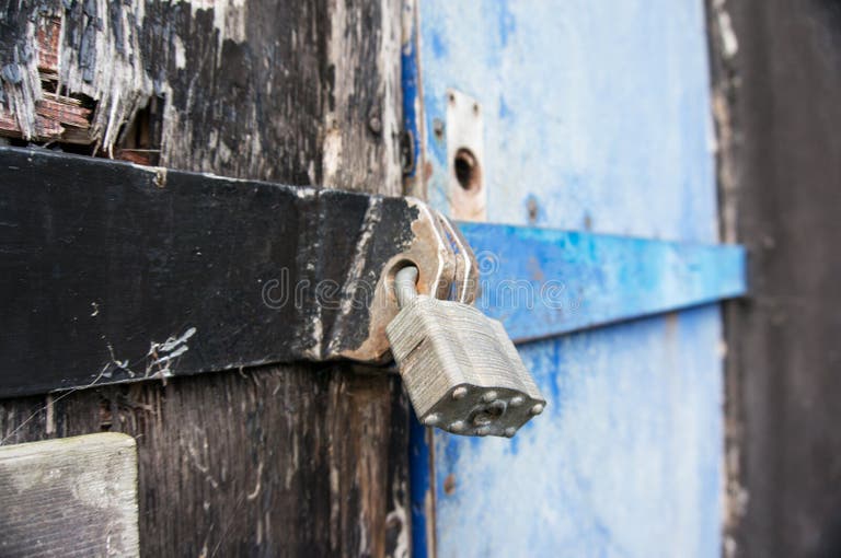 Secure Padlock on a Building Stock Image - Image of selective, store ...