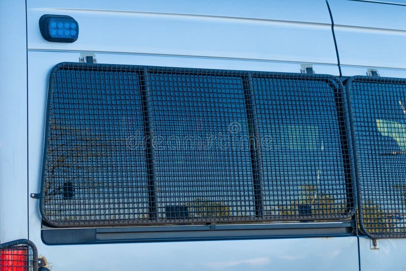 Secure Police Van Window with Protective Mesh Guard and Blue Light ...