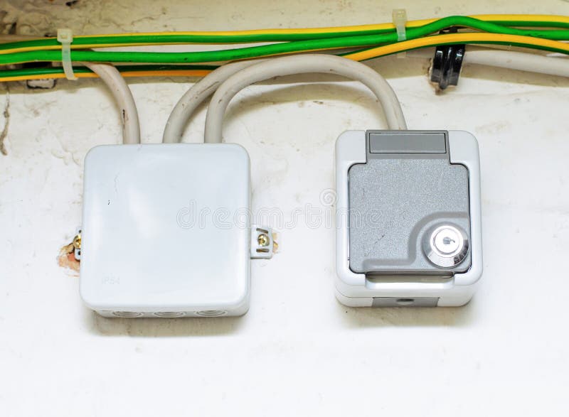 Secured Wall Socket with Lock and Adjacent Junction Box on Basement ...