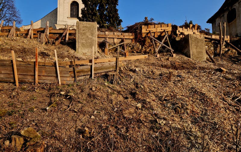 Securing the Slope Against Erosion. the Repair of the Cemetery Wall is ...