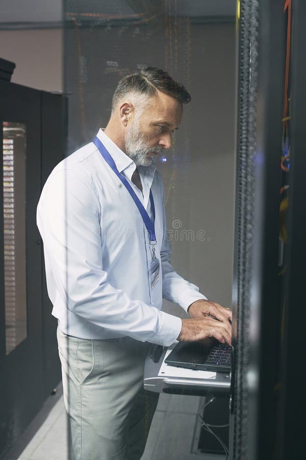 Securing a Stable Connection. a Mature Man Using a Laptop while Working ...