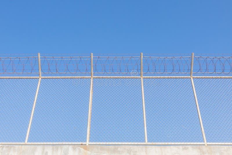 Security with a Barbed Wire Fence Stock Image - Image of barbwire ...