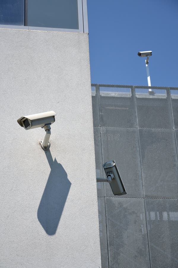 Security Camera Behind Barbed Wire Fence Around Prison Walls Stock ...