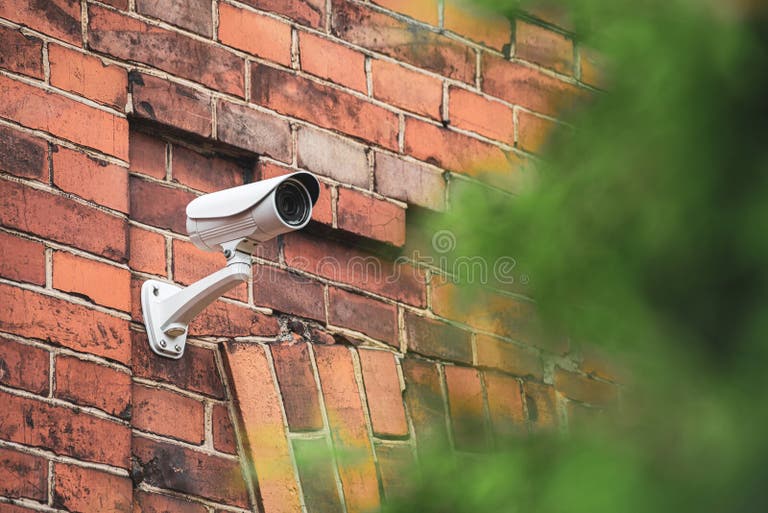 Security Camera on Brick Wall with Greenery Stock Image - Image of ...
