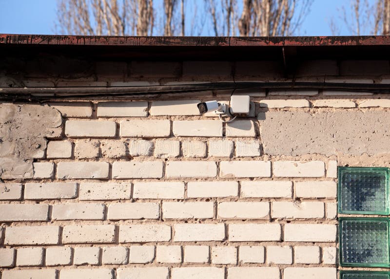 Security Camera, CCTV. Security Camera on the Brick Wall. Video ...
