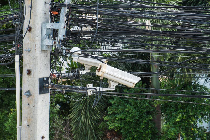 Security Camera on Electric Pole with Maze Electric Cables Stock Image ...