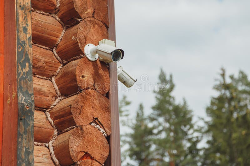 Security Camera Installed on the Corner of Log Wooden House Stock Image ...