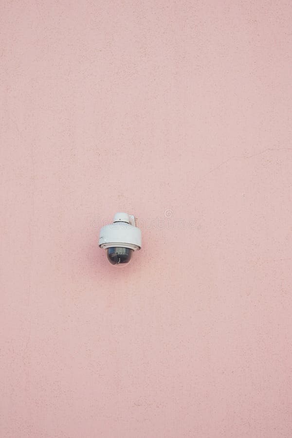 Security Camera Mounted on a Pink Wall in Bright Daylight Stock Photo ...