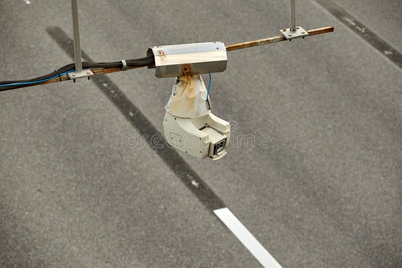 Security Camera Operating Over the Road, Daytime. Stock Photo - Image ...