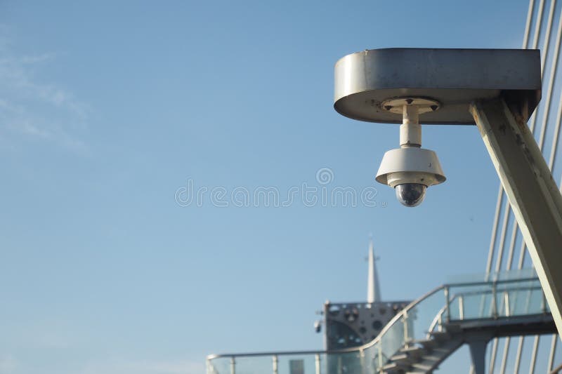 Security Camera Overlooking a Modern Urban Bridge during Daylight Stock ...