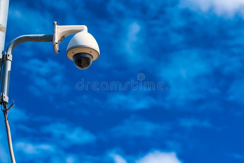 Security Camera on a Pole Against Blue Sky Background Stock Photo ...