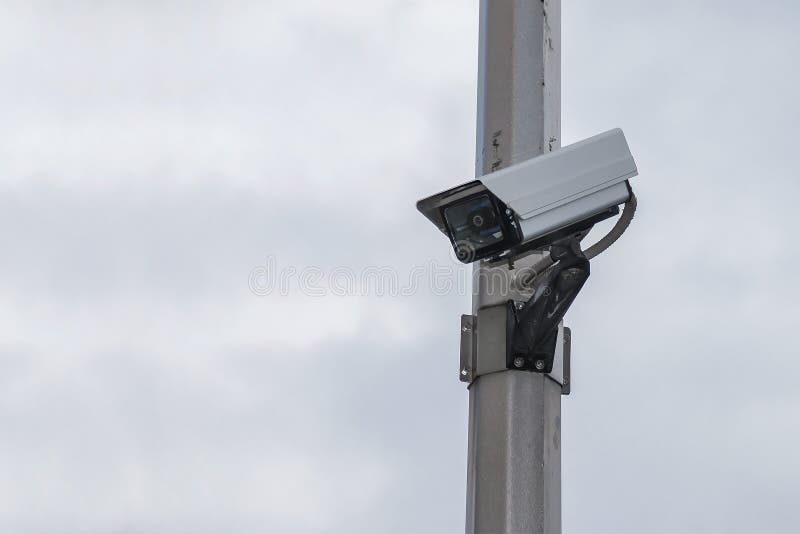 Security camera on post stock photo. Image of looking - 10098184