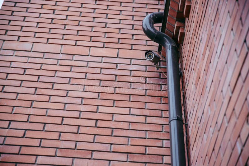 Security Camera on Red Brick Wall Stock Photo - Image of building ...