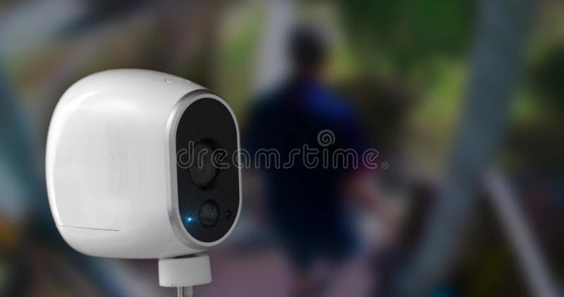 A Security Camera Rotating with a Blurry Background with a Person ...
