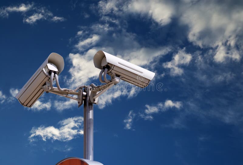 Security camera on the sky stock photo. Image of blue - 5551868