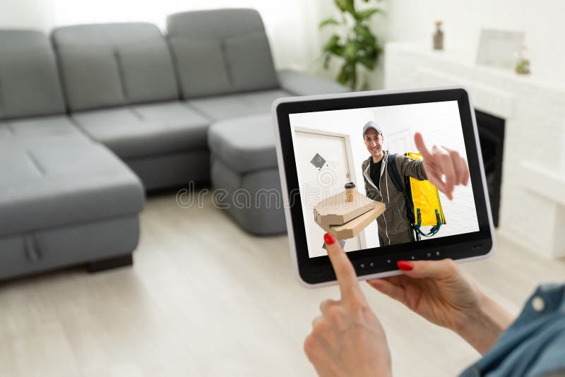 Security Camera System on Tablet App - Delivery Man Holding Package in ...