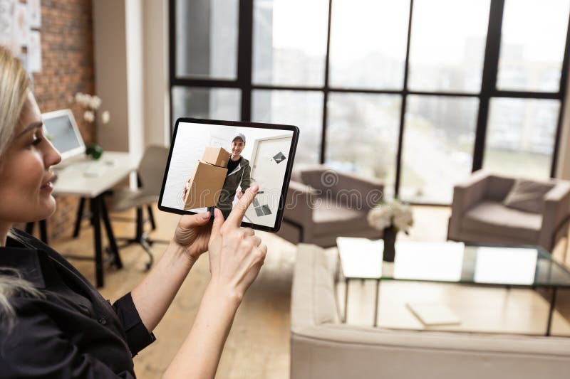 Security Camera System on Tablet App - Delivery Man Holding Package in ...