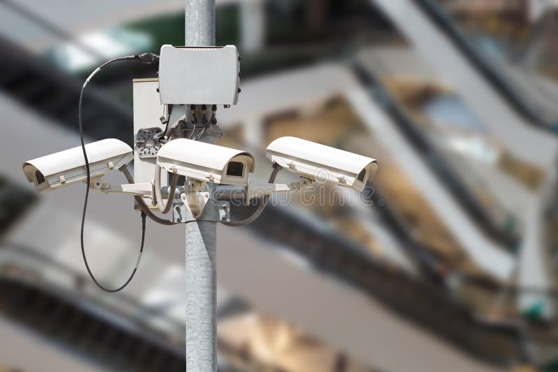 Security Cameras with Blurry Modern Building Background Stock Photo ...