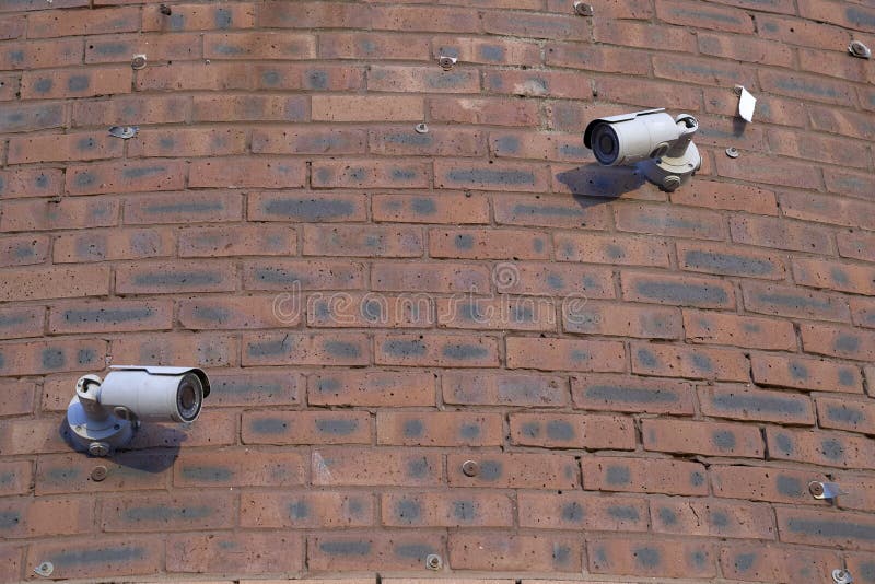 Security Cameras On The Brick Wall Stock Image - Image of electronic ...