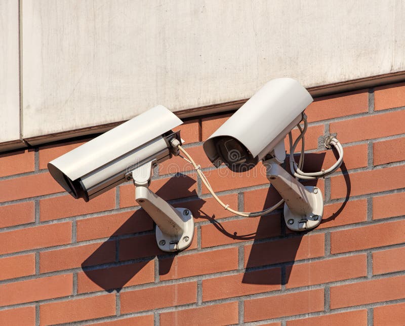 Security Cameras on a Building Wall Stock Photo - Image of surveillance ...