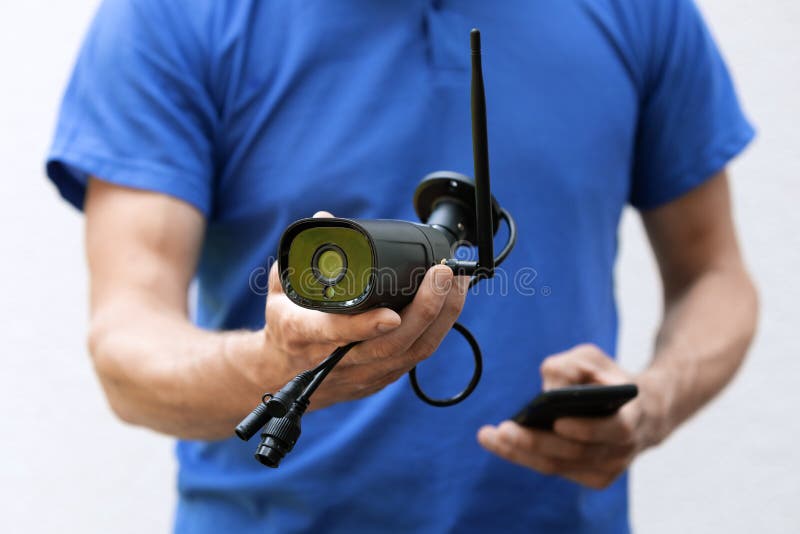 Security Cameras and Cctv Services - Technician with Ip Camera in Hand ...