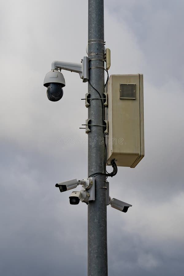 Security Cameras on a Metal Post Stock Photo - Image of electric ...