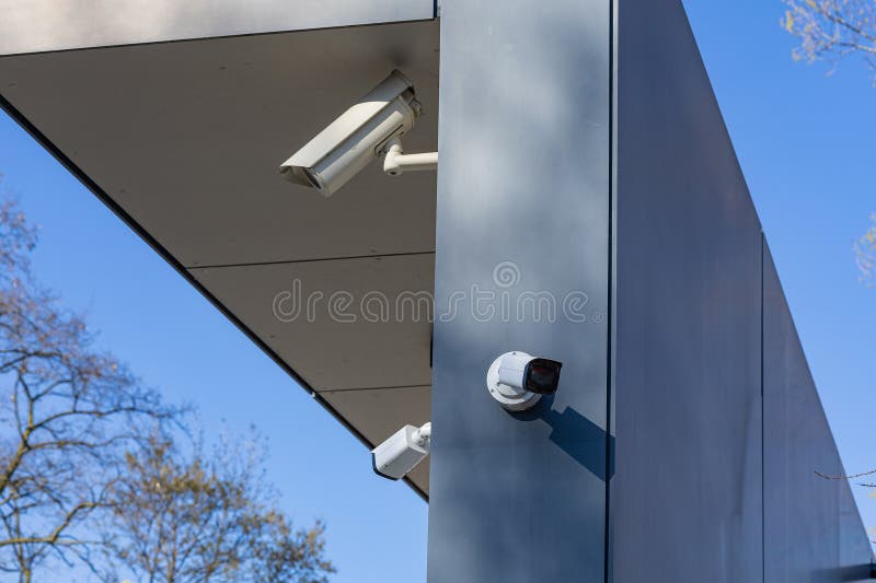Security Cameras Mounted on Modern Building Exterior, Capturing ...
