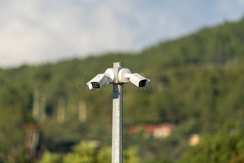 2 Security Cameras on the Pole Stock Image - Image of modern, plant ...