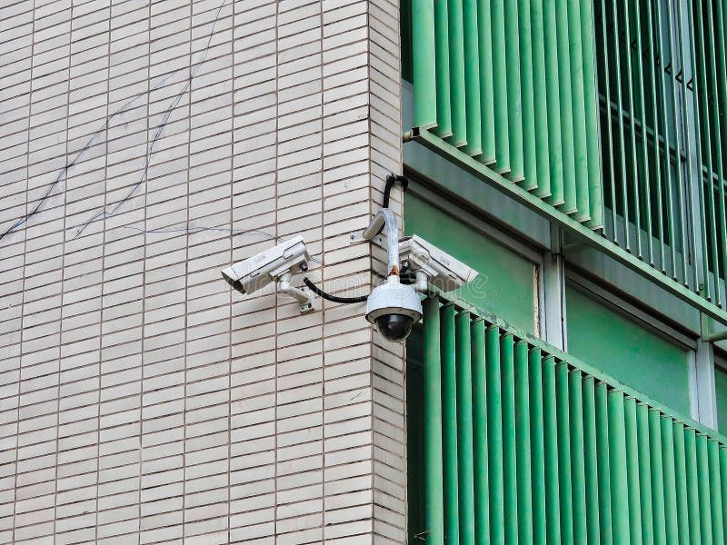 Security Cameras on Pole with Building in Background Stock Image ...
