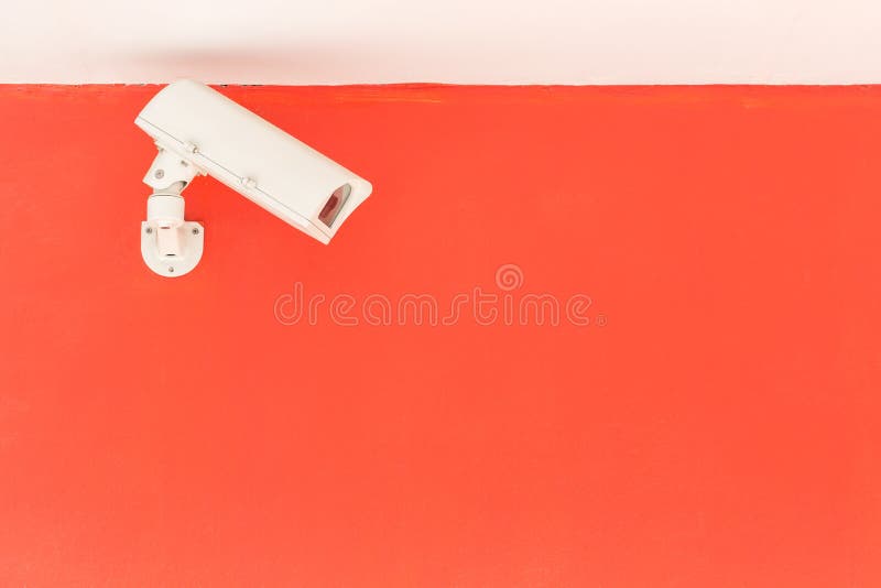 Security CCTV Camera Operating on the Red Building Wall Stock Photo ...