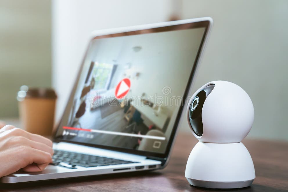 Security CCTV Camera on the Table and Using Laptop with Looking Video ...