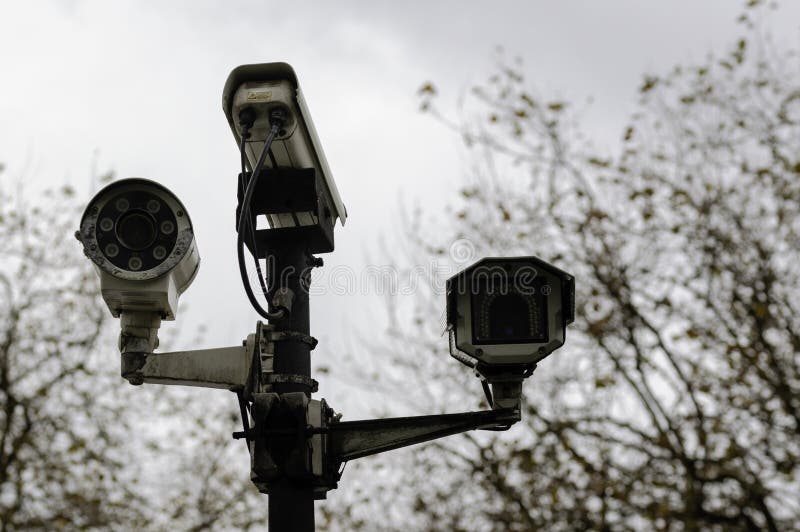Security CCTV Cameras on a Lamp Post in the Park Stock Image - Image of ...