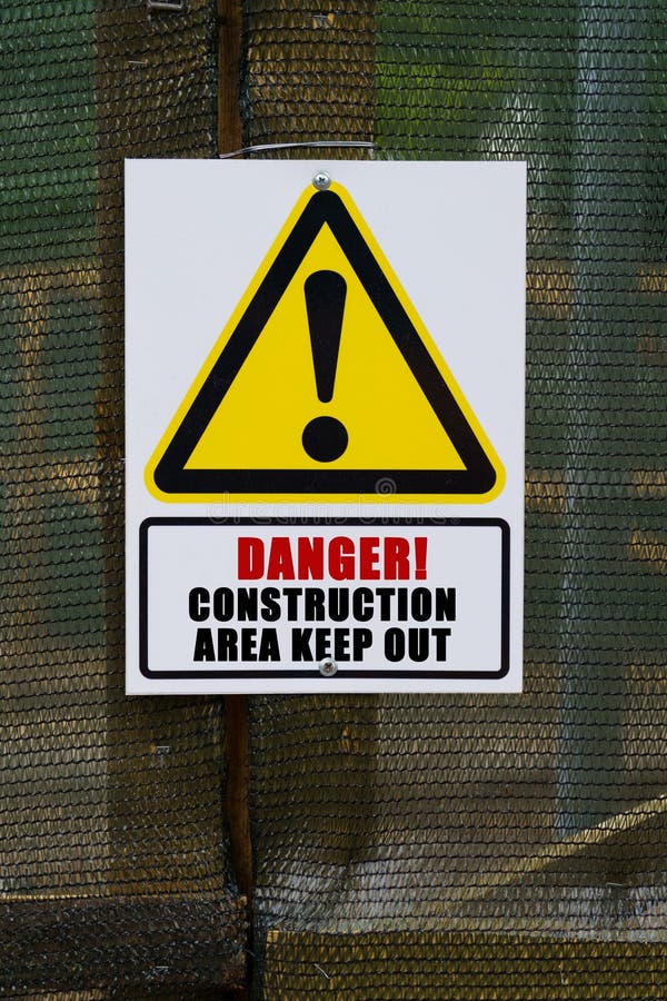 On the Fence Hangs a Warning Sign and a Sign with the Inscription ...