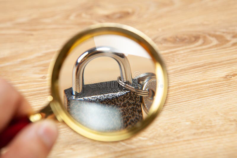 Security Concept. Lock and Magnifying Glass on the Table Stock Image ...