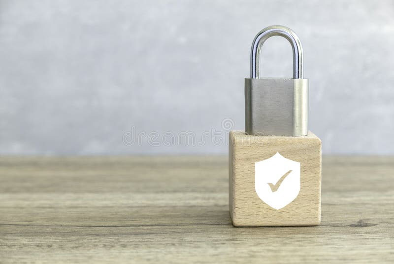 Security Concept: Metal Padlock and Wooden Block with Shield and ...